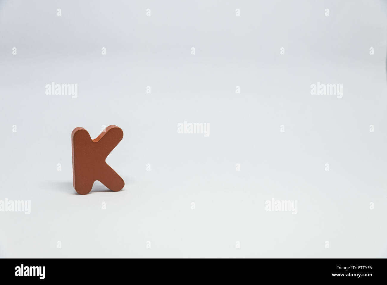 Brown Wooden alphabet K with white background Stock Photo - Alamy