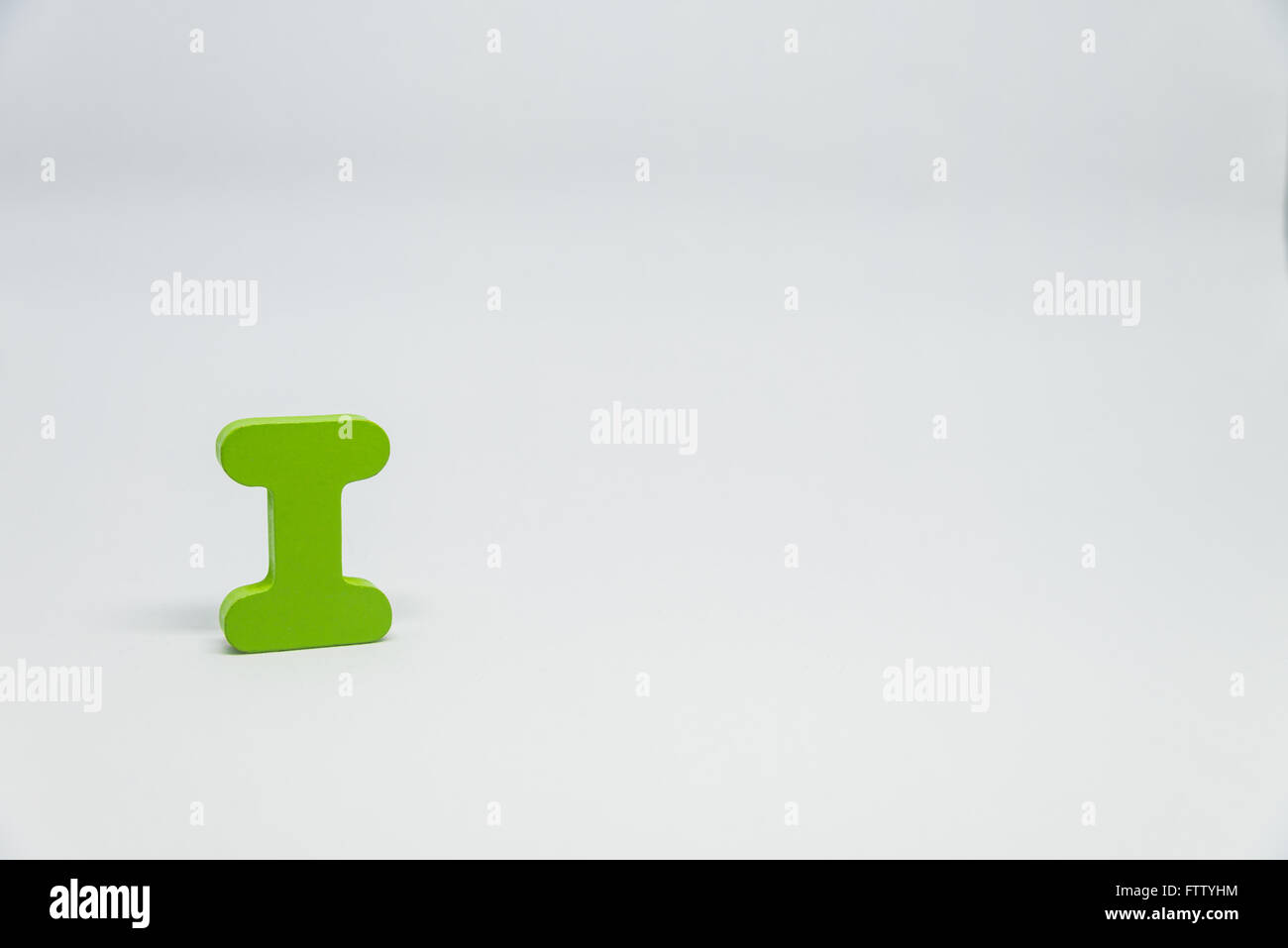 Green Wooden alphabet I with white background Stock Photo - Alamy