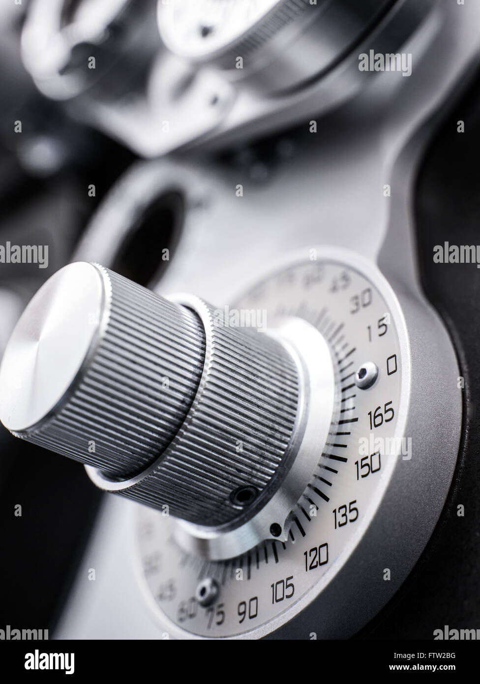 Photograph of a dial on a phoropter in an eye doctor's office. The dial ...
