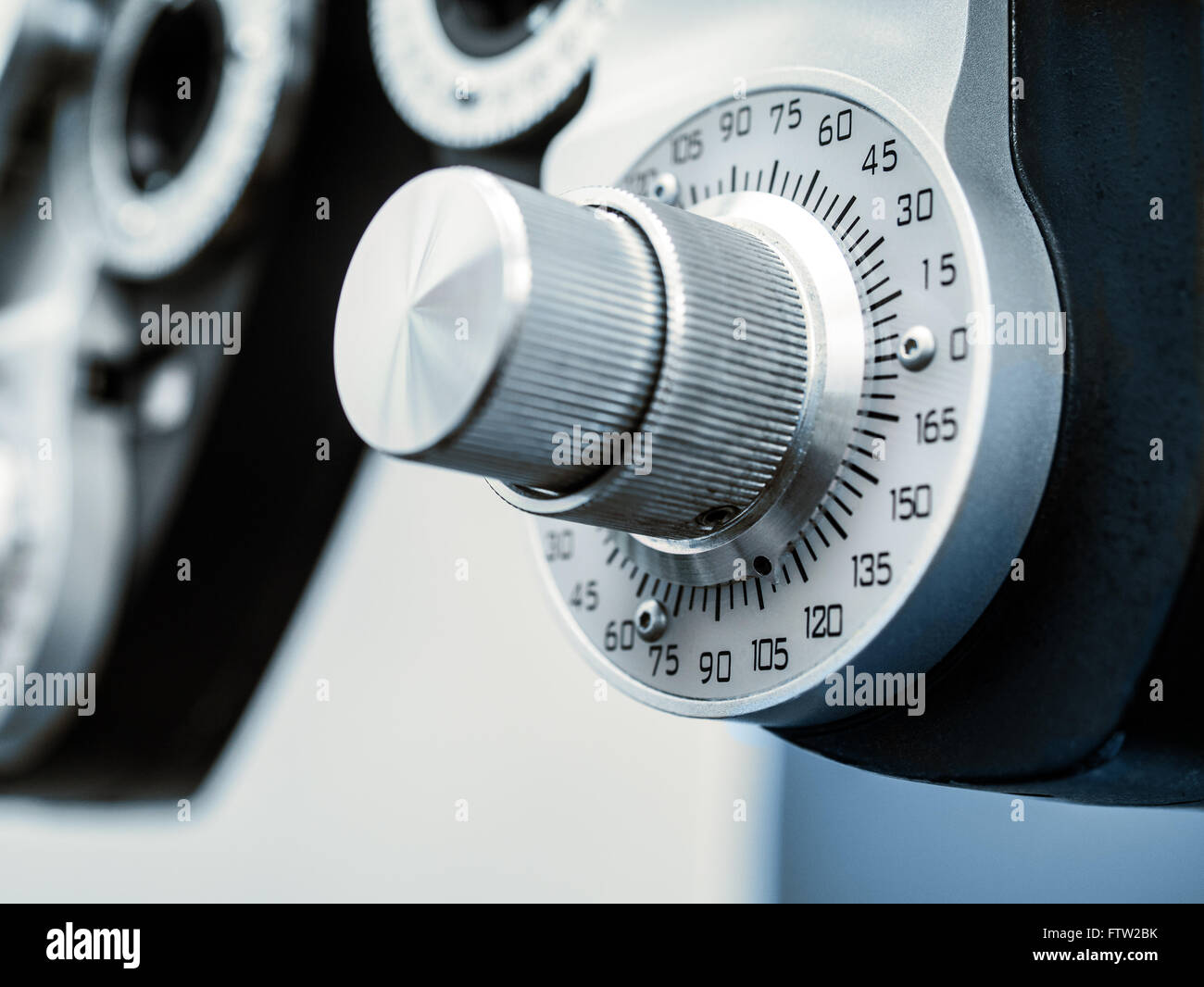 Photograph of a dial on a phoropter in an eye doctor's office. The dial ...