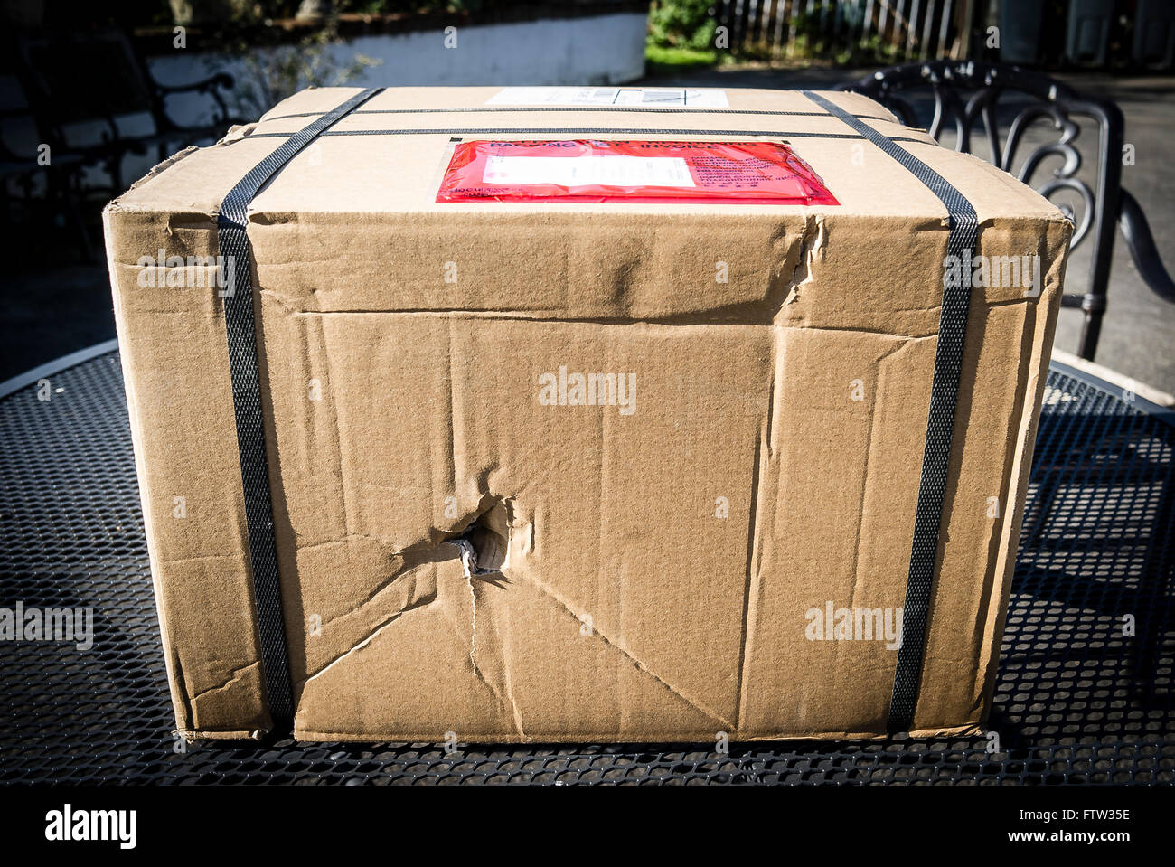 Delivered parcel showing signs of damage in transit Stock Photo - Alamy