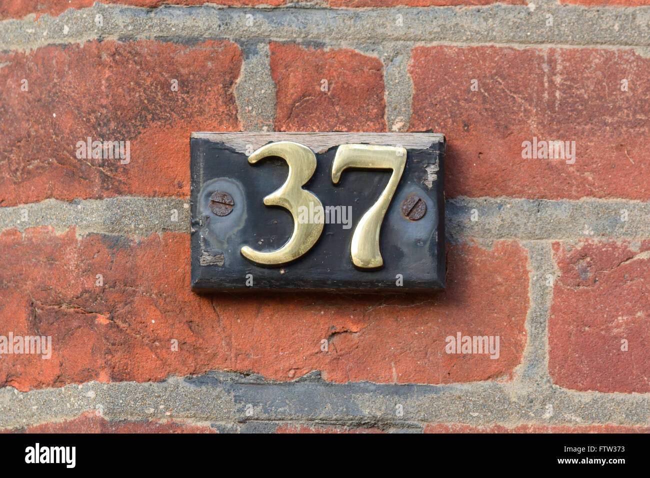 House number 37 sign on wall Stock Photo - Alamy