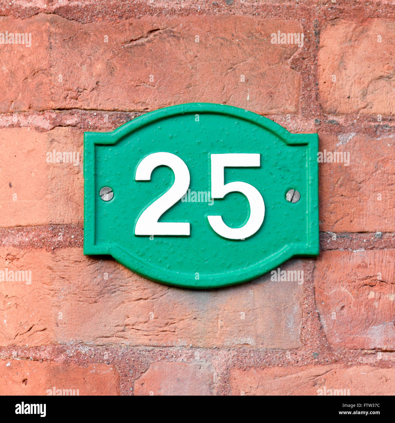 House number 25 sign on wall Stock Photo - Alamy