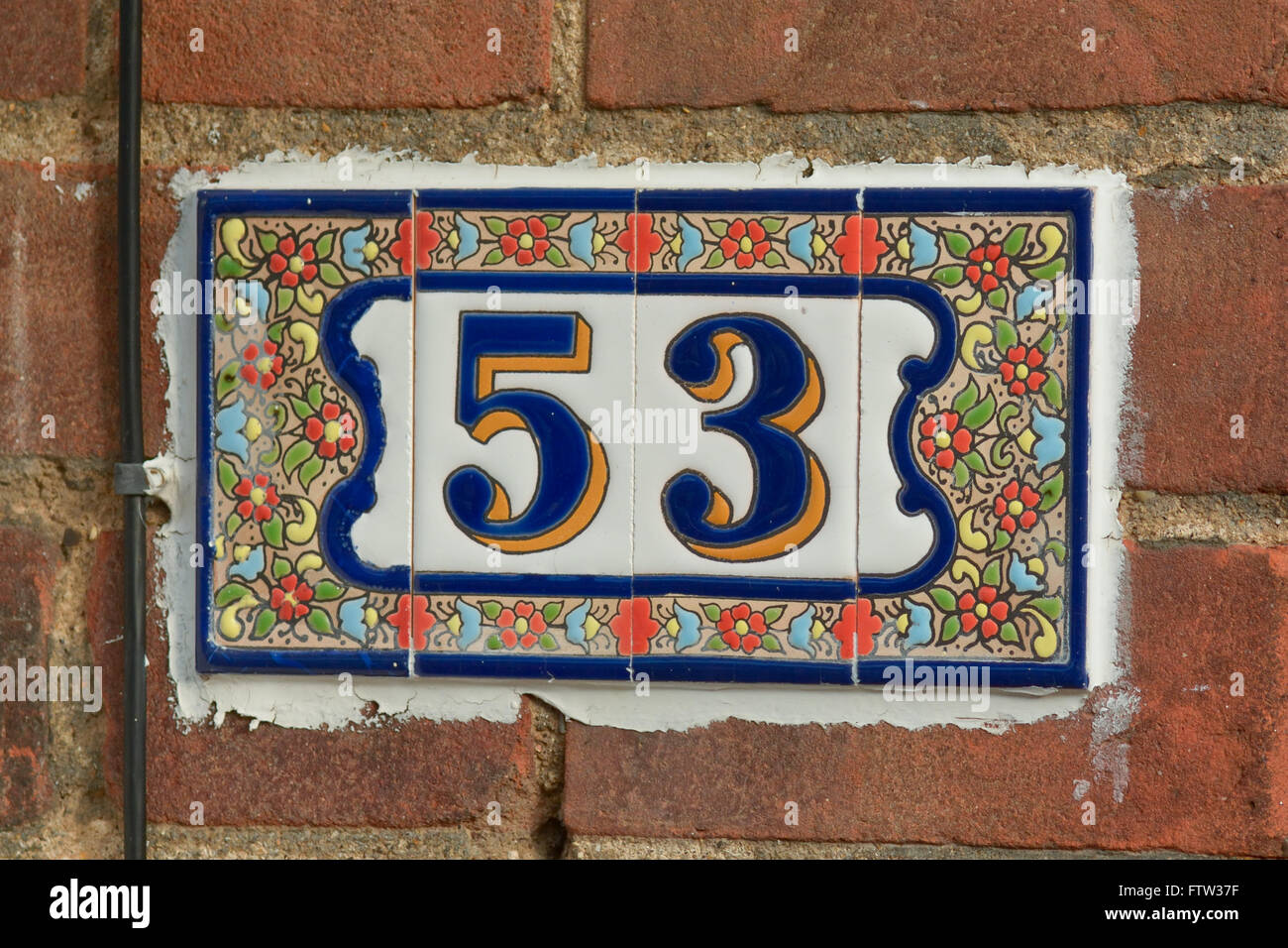 House Number 53 ceramic tiles sign on wall Stock Photo - Alamy