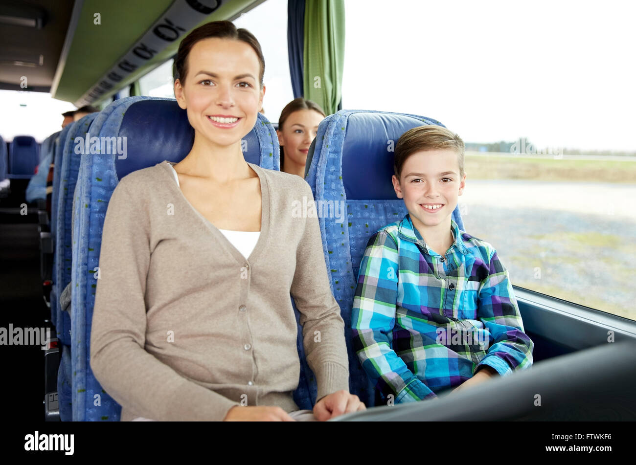 happy family riding in travel bus Stock Photo - Alamy