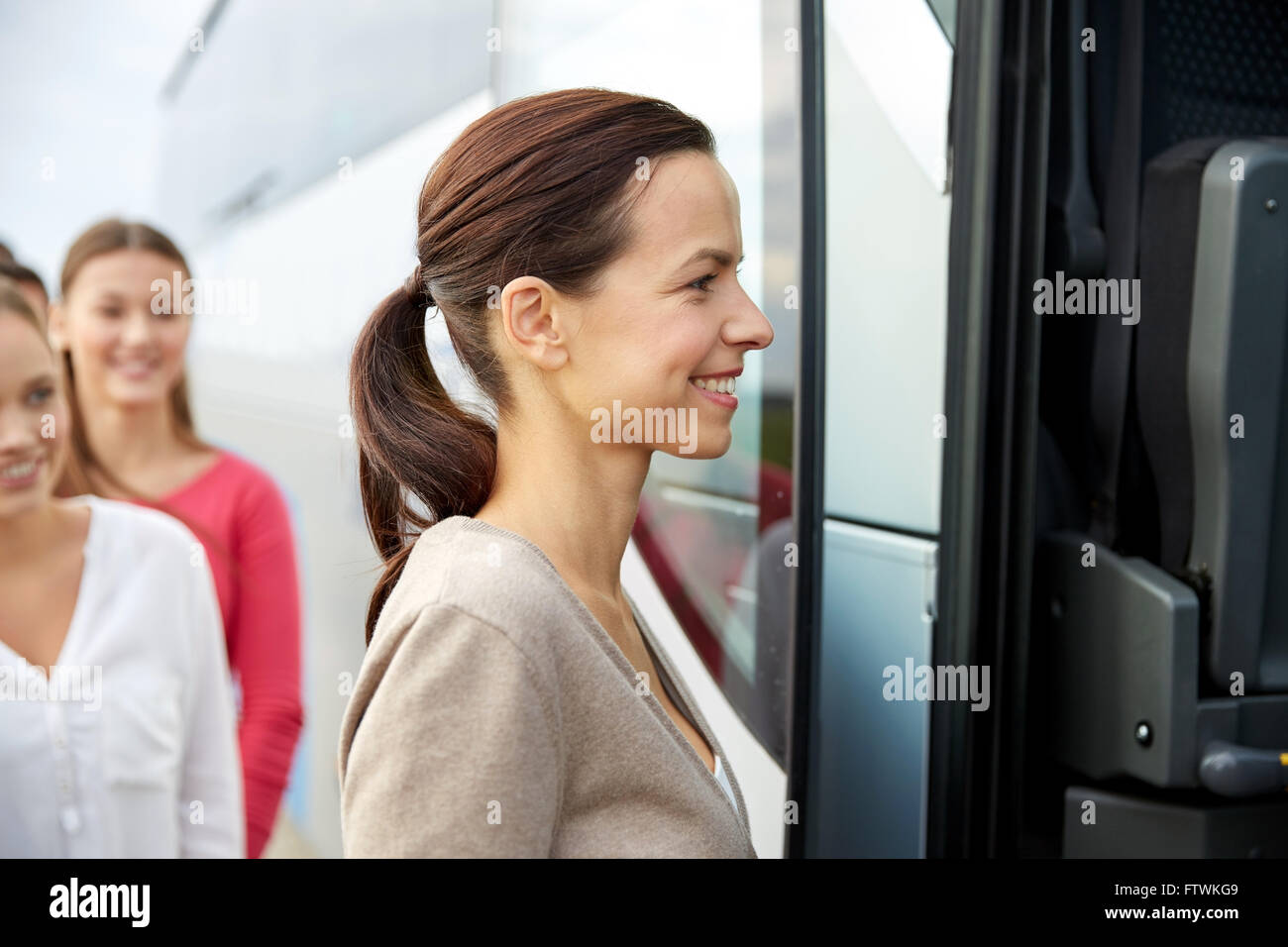 group of happy passengers boarding travel bus Stock Photo - Alamy