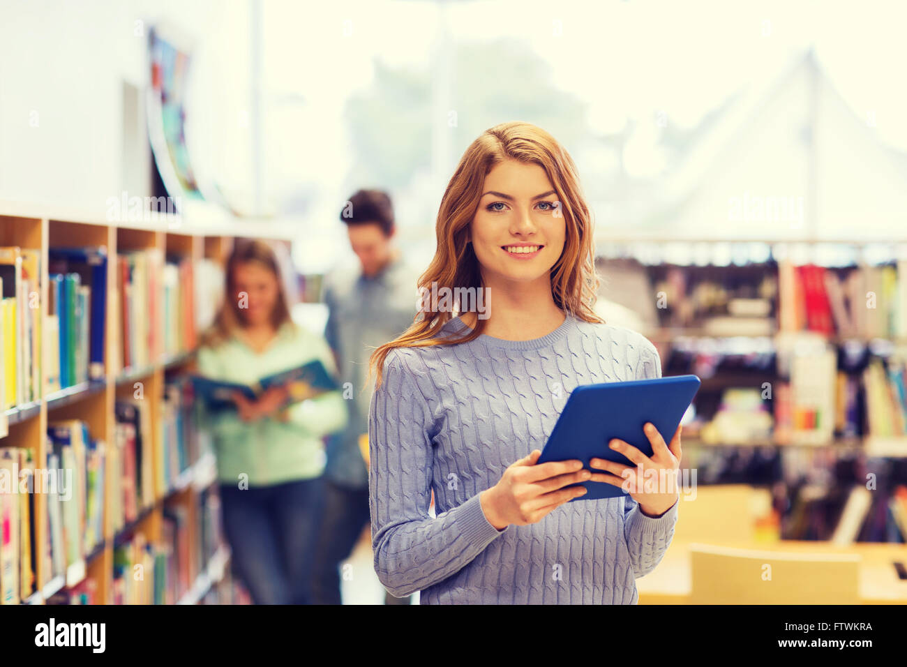 Teen tablet library hi-res stock photography and images - Alamy