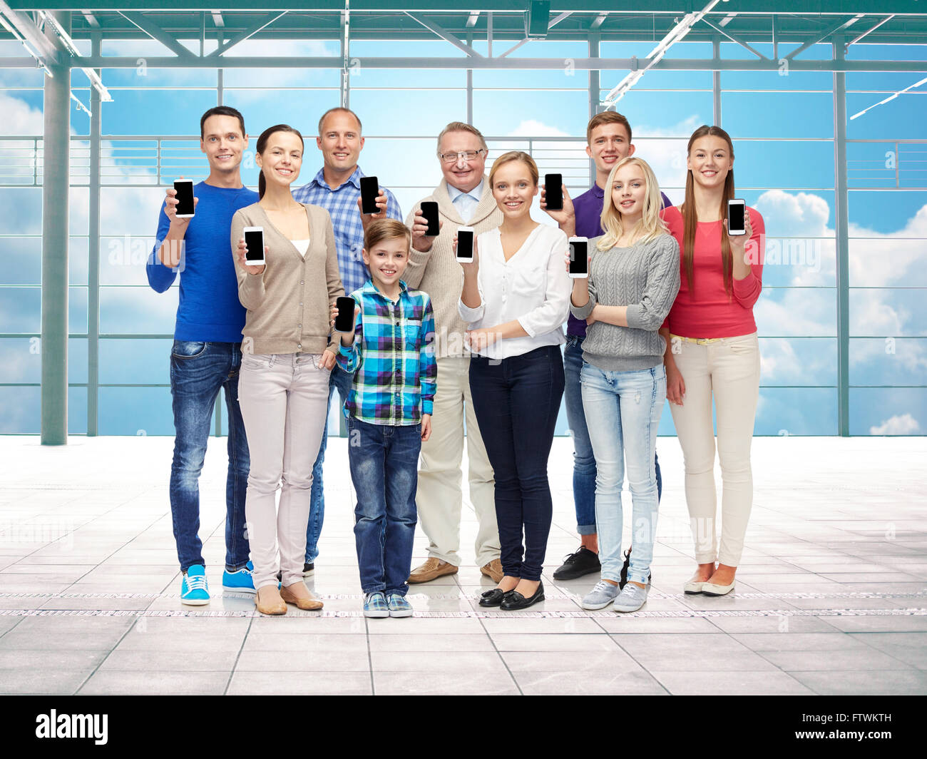 group of smiling people with smartphones Stock Photo - Alamy