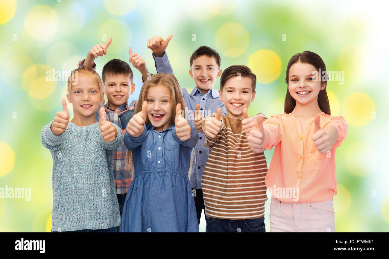 happy children showing thumbs up Stock Photo - Alamy