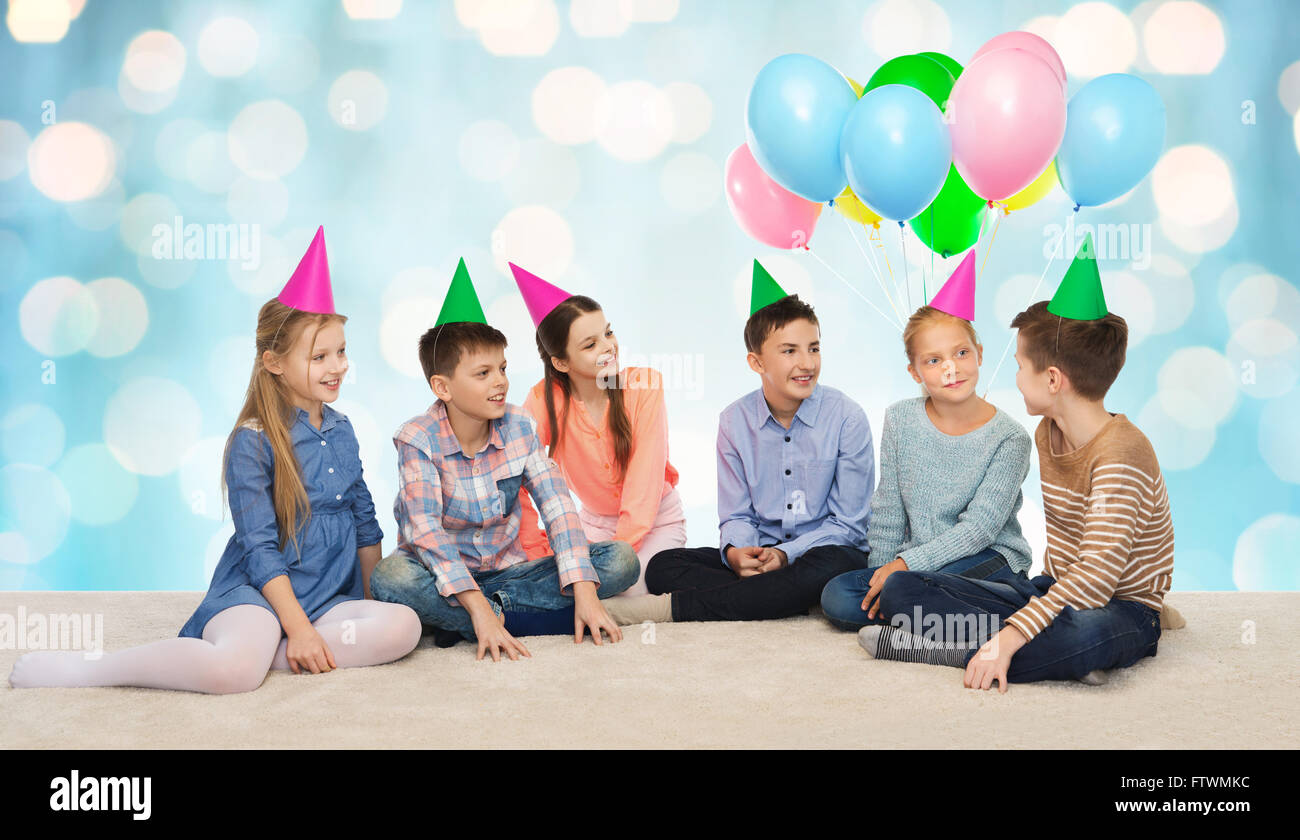 happy smiling children in party hats on birthday Stock Photo - Alamy
