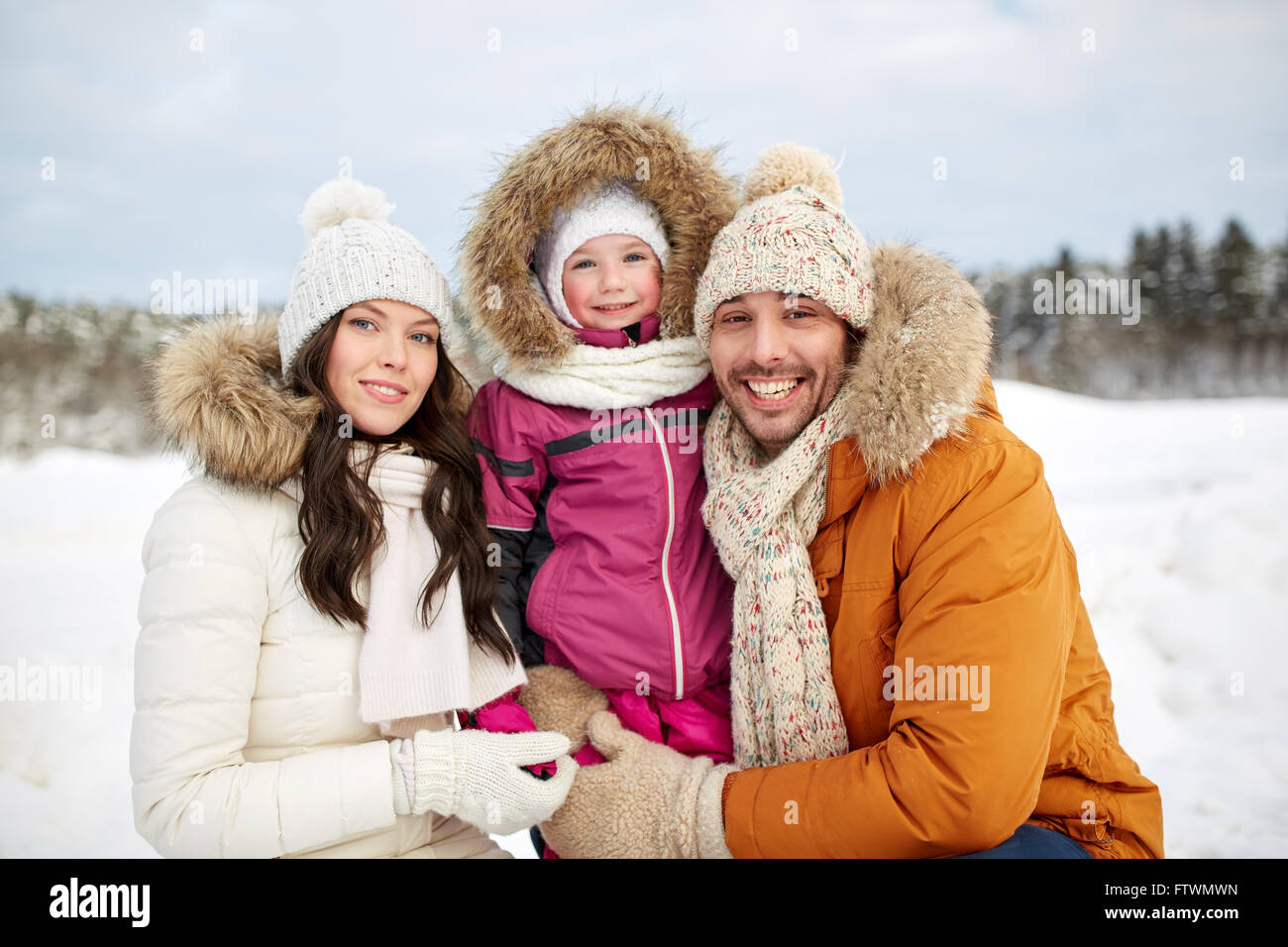 happy family with child in winter clothes outdoors Stock Photo - Alamy