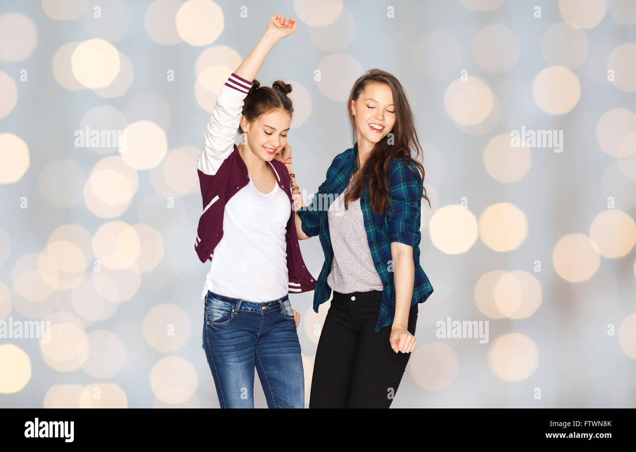 happy smiling pretty teenage girls dancing Stock Photo - Alamy
