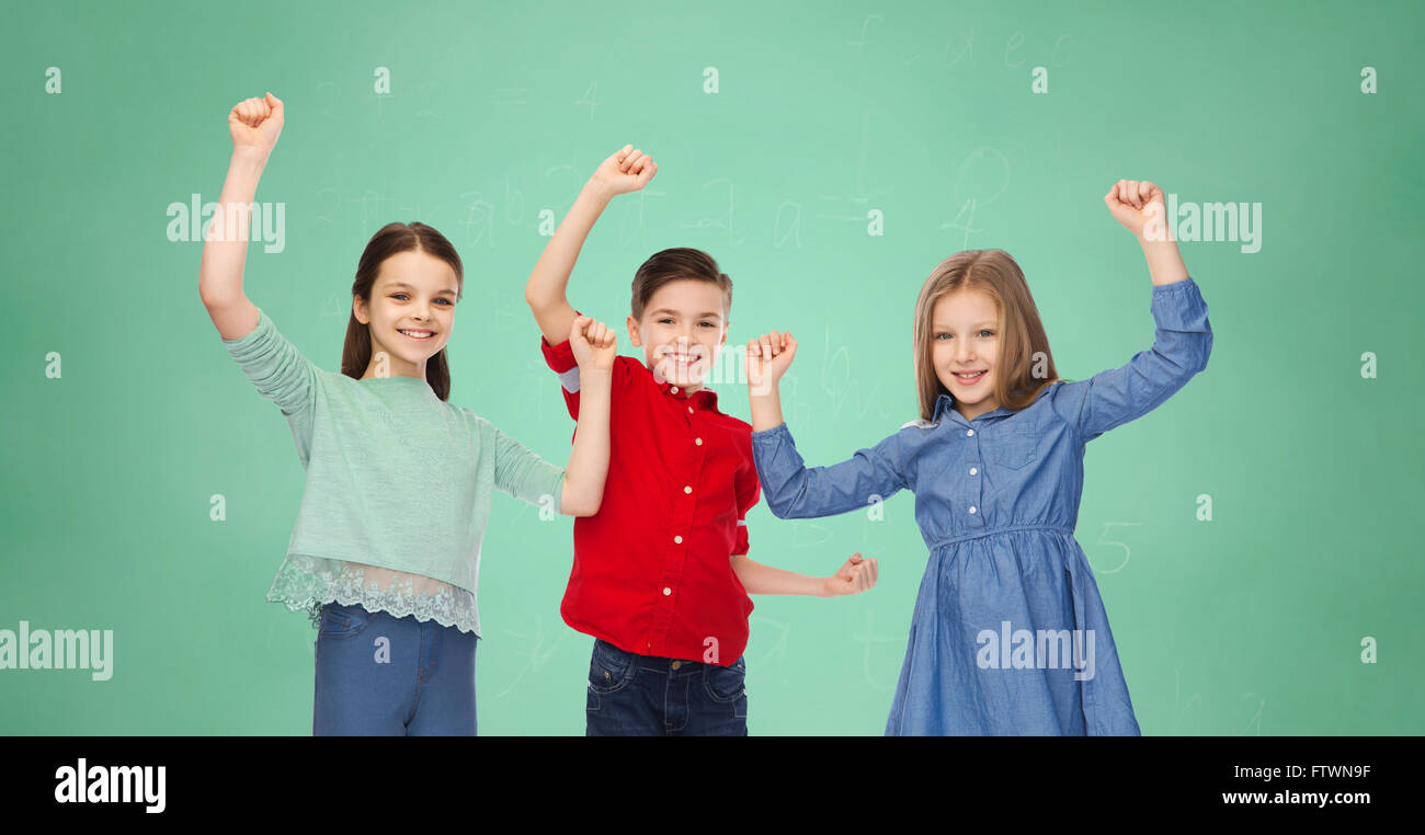 happy boy and girls celebrating victory Stock Photo - Alamy