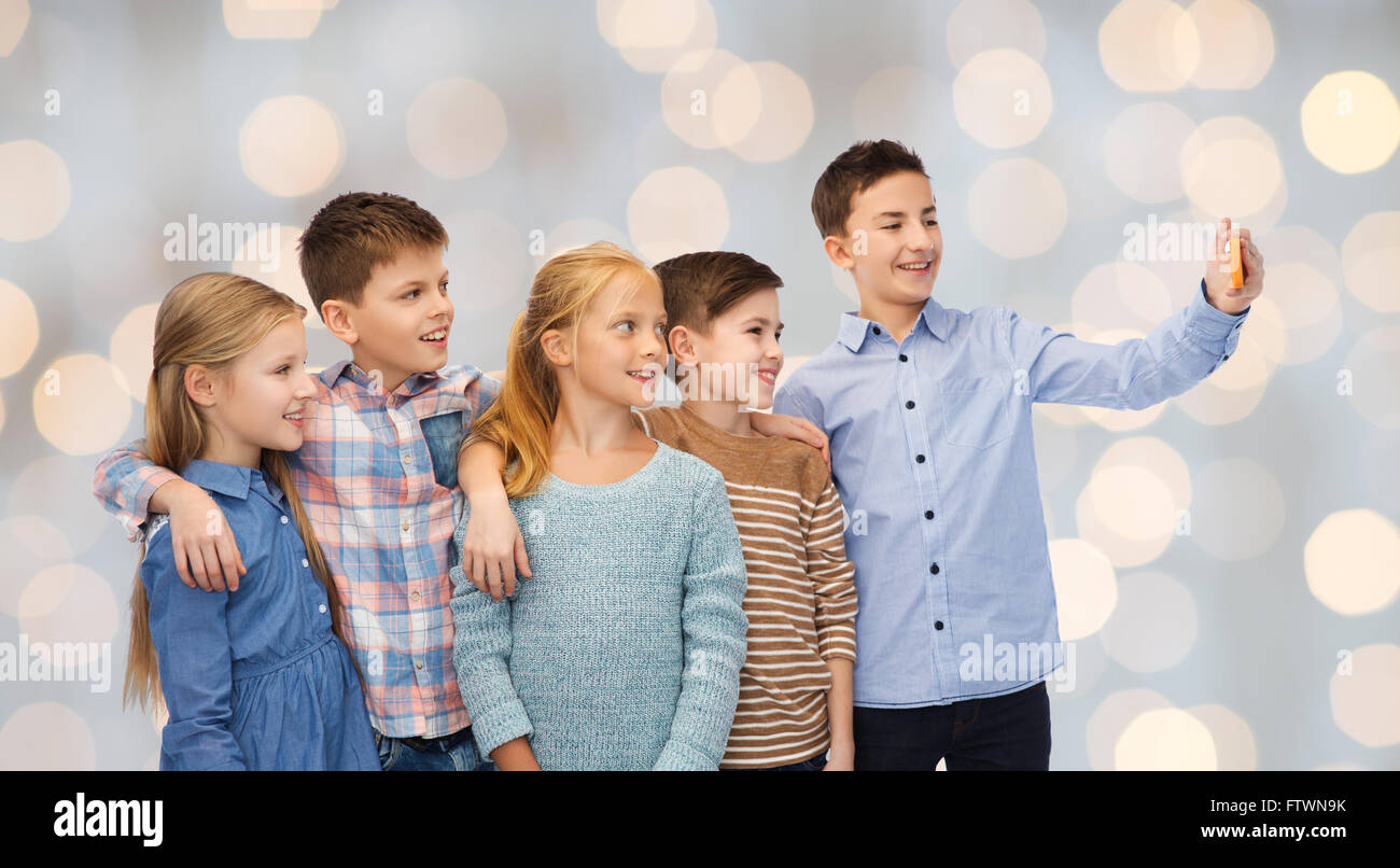 happy children talking selfie by smartphone Stock Photo - Alamy