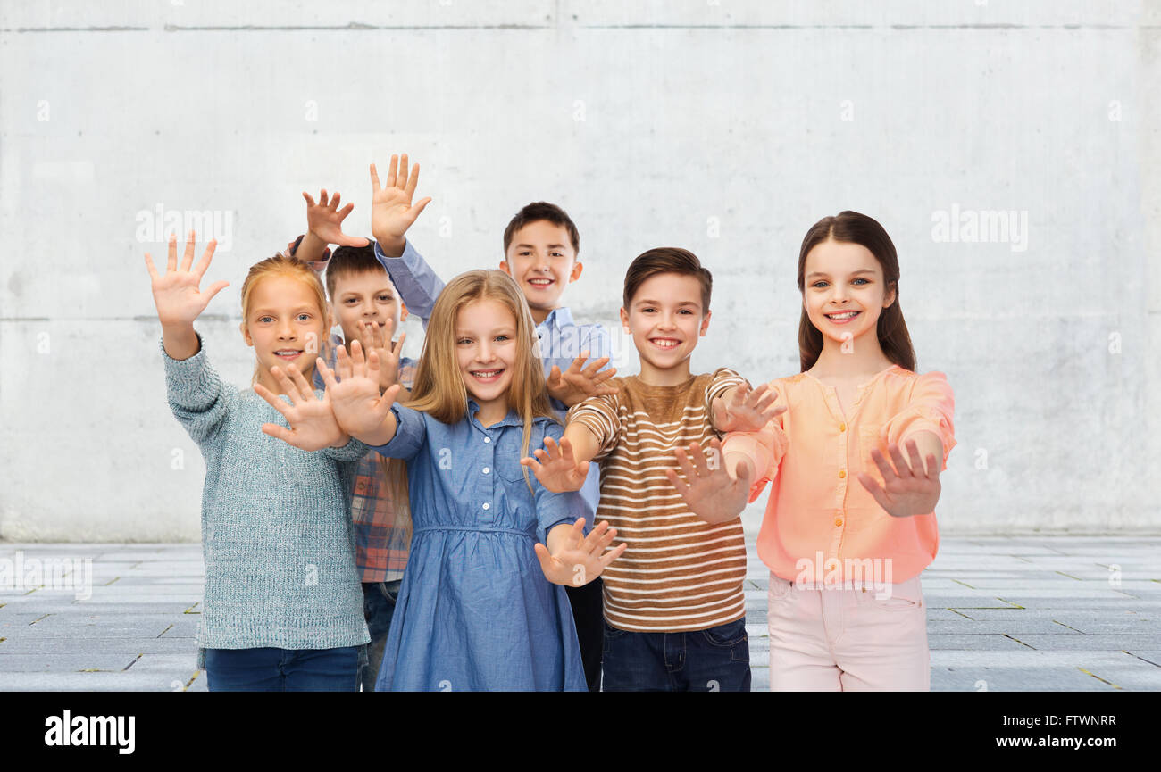 happy children waving hands Stock Photo - Alamy