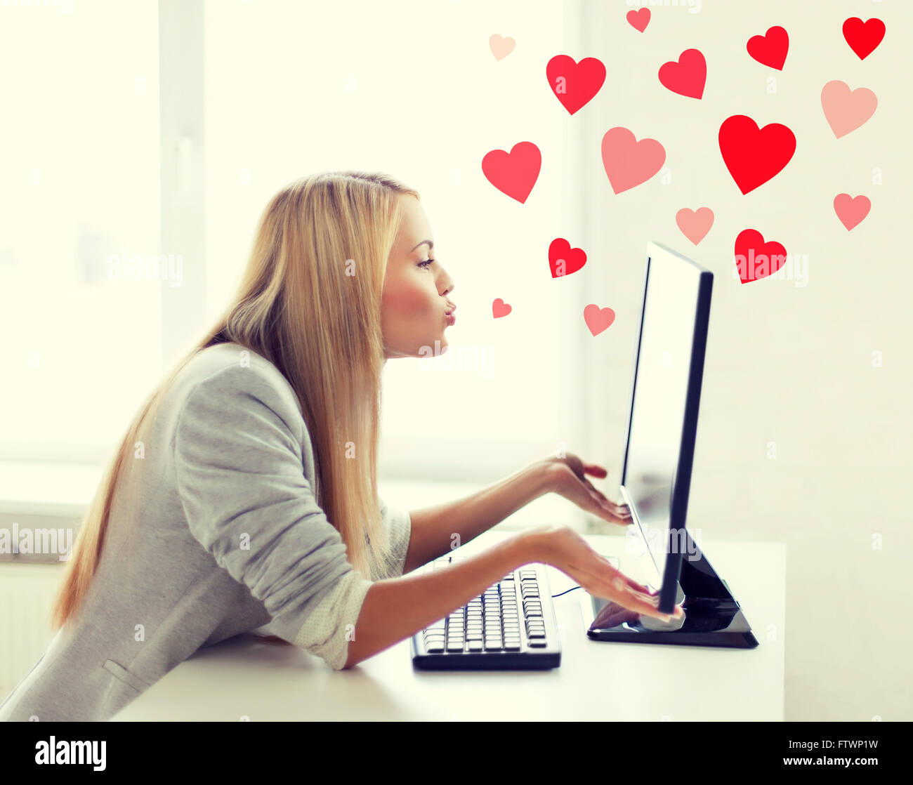Woman sending kiss online hi-res stock photography and images - Alamy