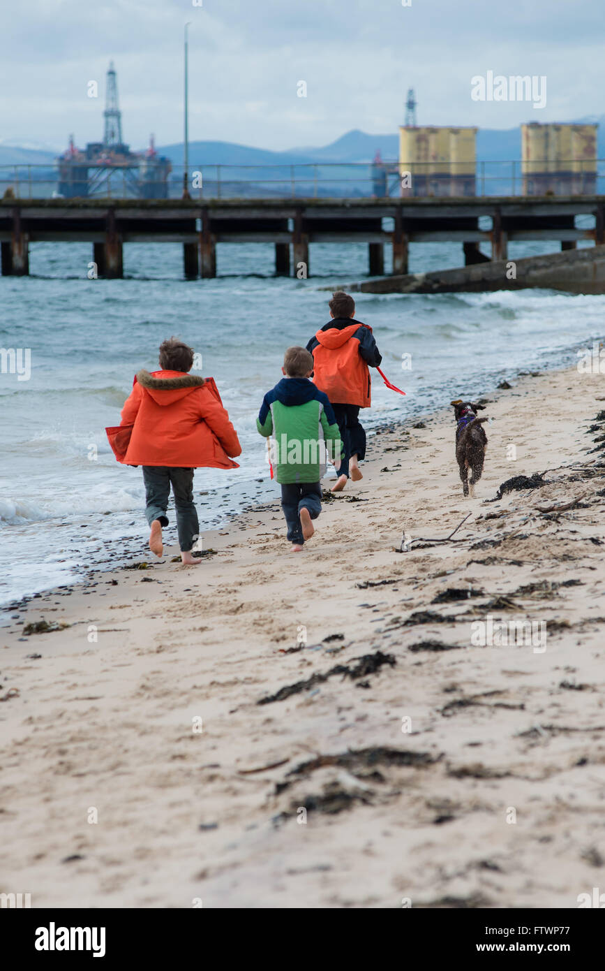 Running boys hi-res stock photography and images - Alamy