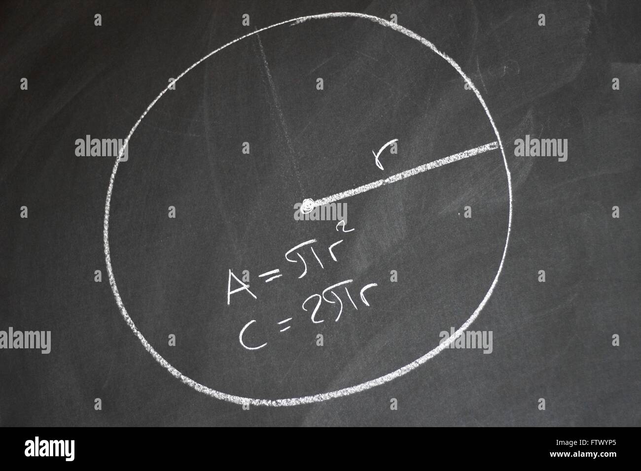 Studying mathematics on a blackboard Stock Photo - Alamy