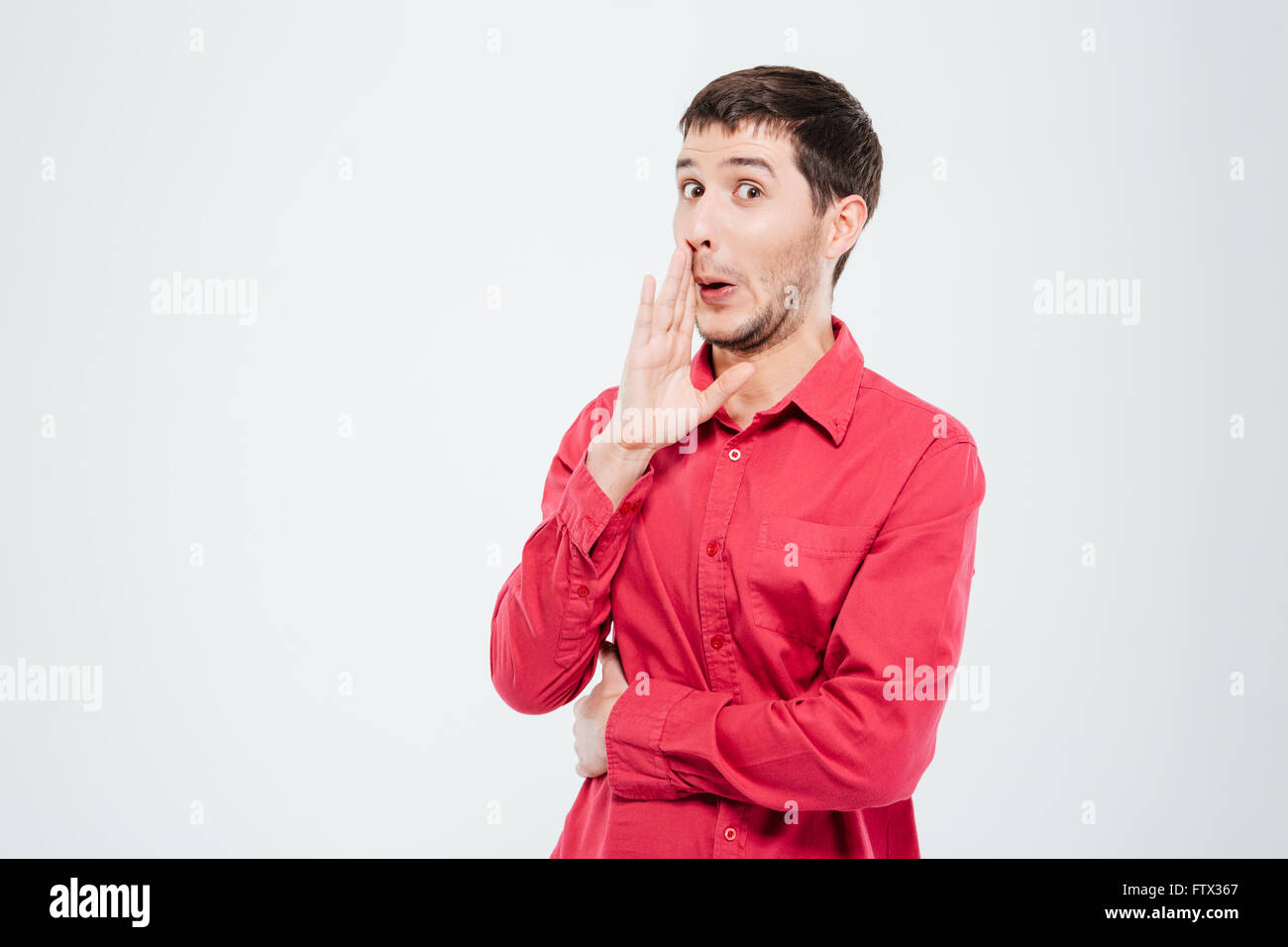 Man whispering gossip isolated on a white background Stock Photo - Alamy