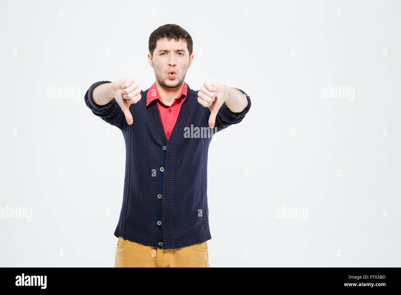 Man showing thumbs down isolated on a white background Stock Photo - Alamy