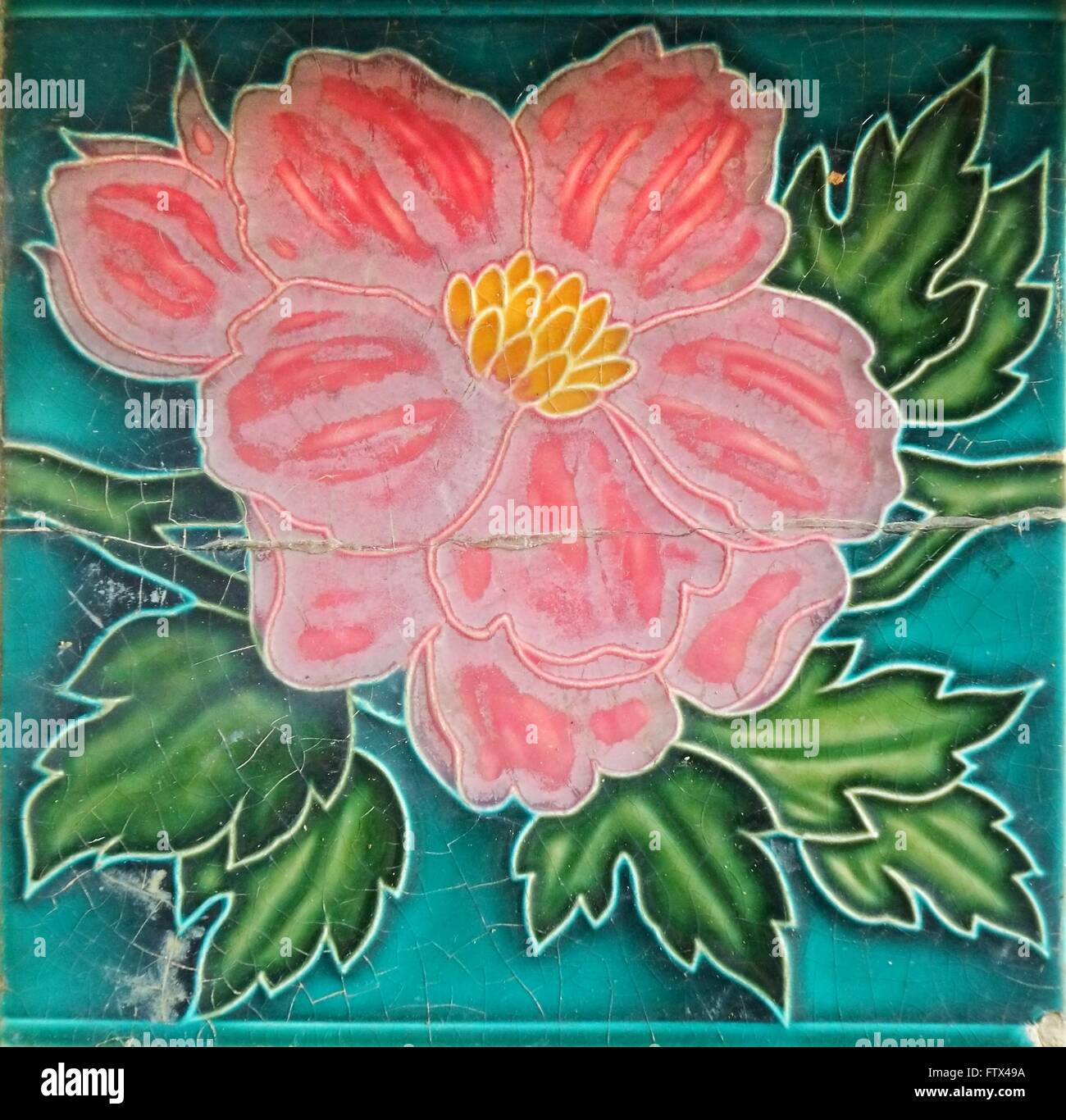 Old Chinese ceramic tile with flower motif Stock Photo - Alamy