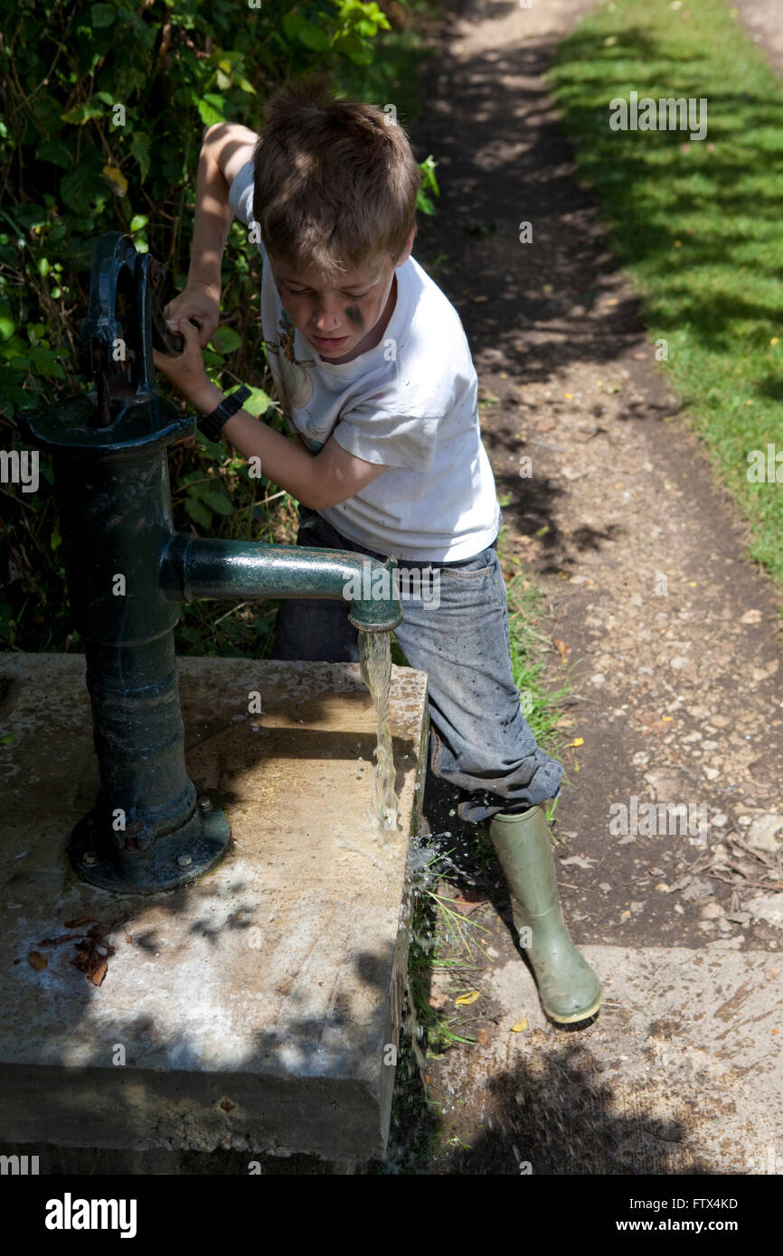 Boy pumping well water hi-res stock photography and images - Alamy