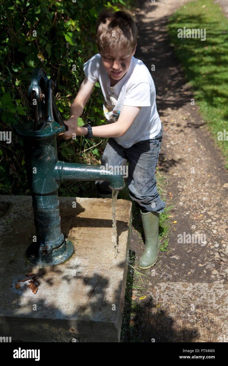 Boy pumping well water hi-res stock photography and images - Alamy