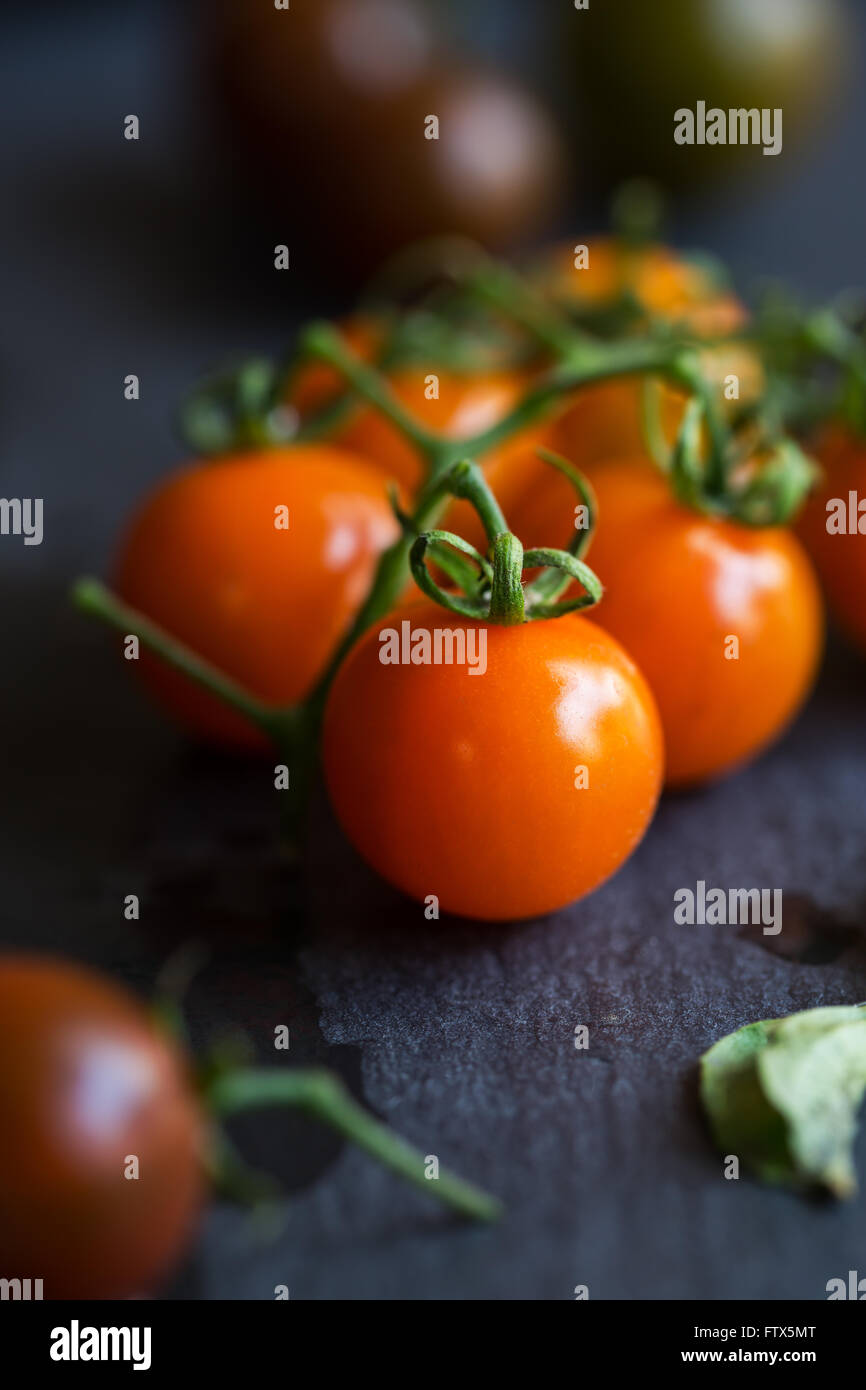 Varieties color of Cherry Tomatoes on stone board Stock Photo - Alamy