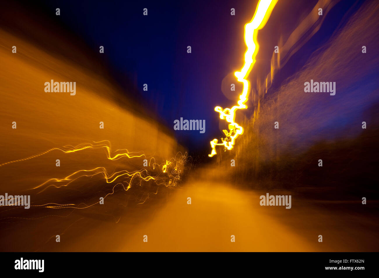 Abstract light patterns that imply movement or travel along roads and ...
