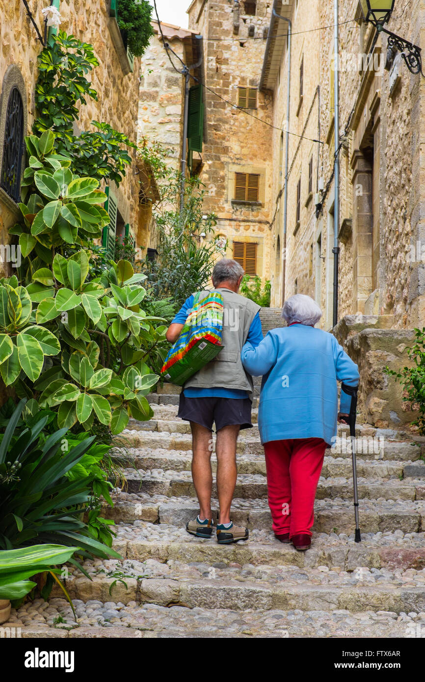 Senior couple climbing stairs, Mallorca , Balearic , Spain ,Valldemossa ...