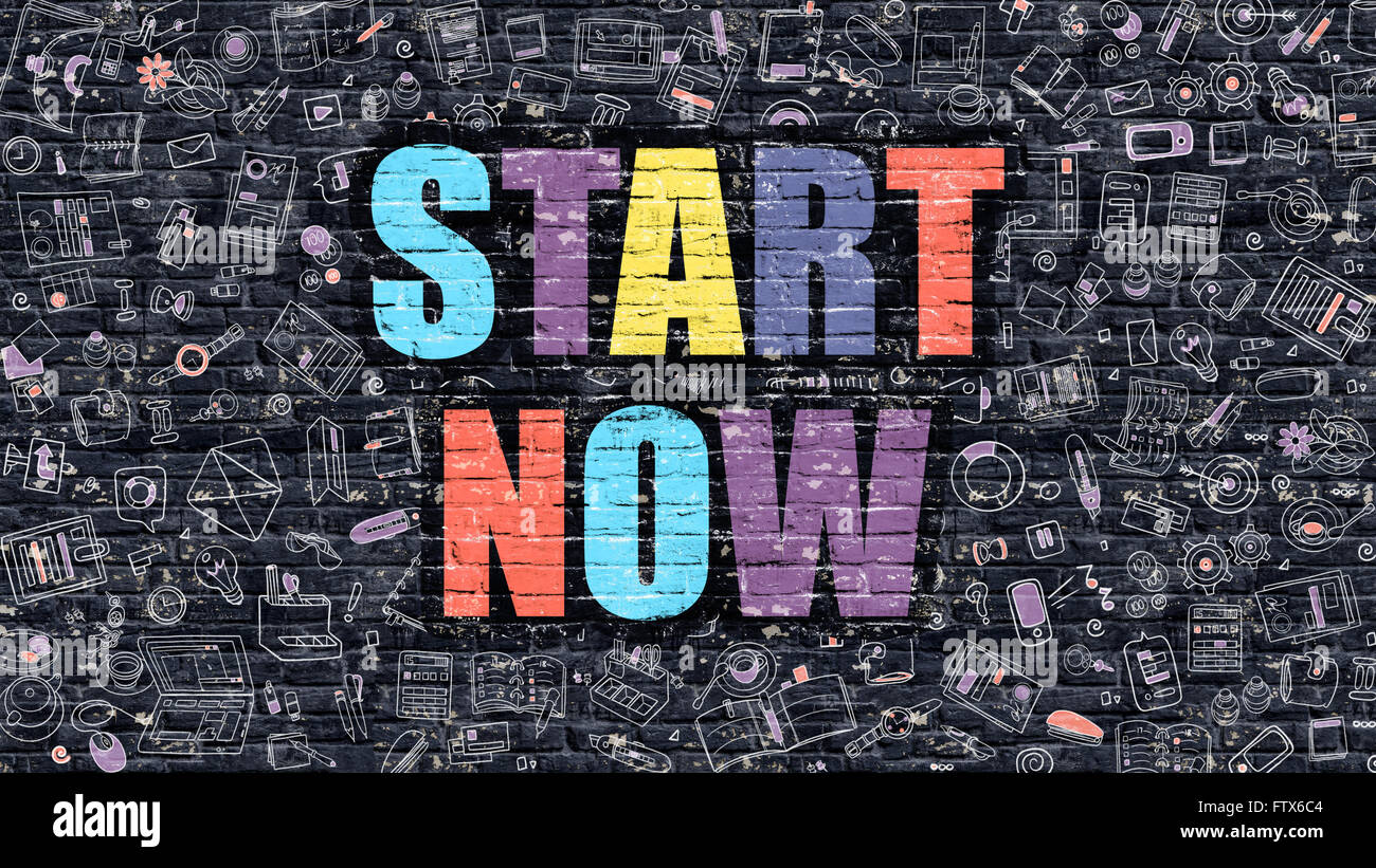 Start Now on Dark Brick Wall Stock Photo - Alamy