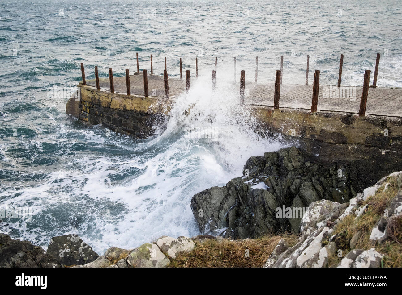 Waves crashing over Craignish Pier Stock Photo - Alamy
