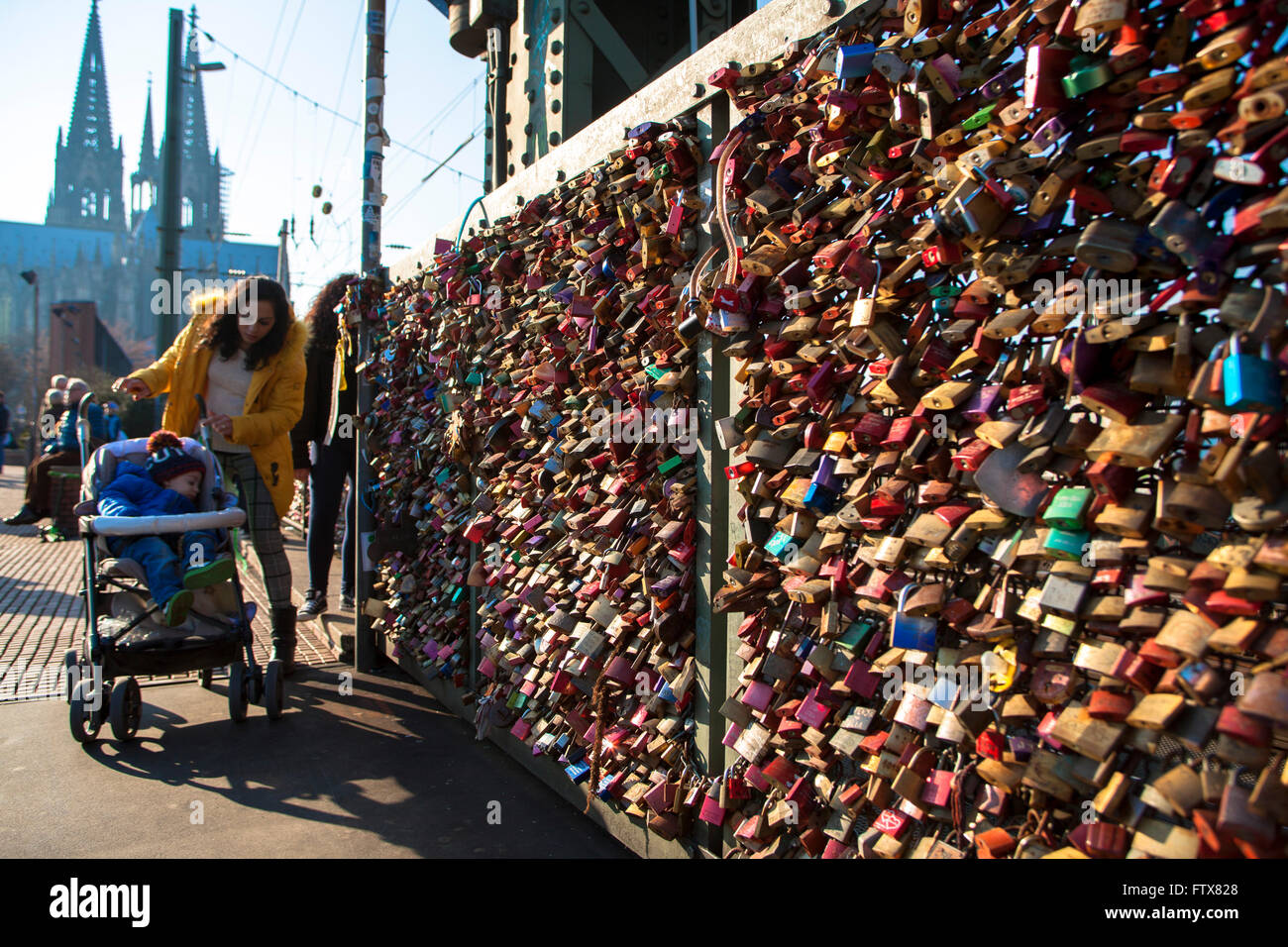 Europe, Germany, Cologne, padlocks on fence of footpath of the ...