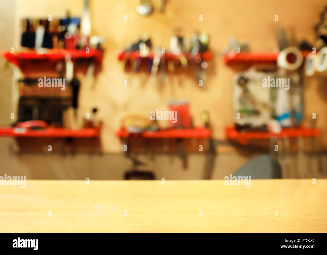 Tools on wall in workshop, blurred background Stock Photo - Alamy