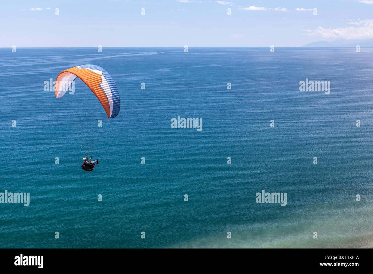 Paragliding above the sea Stock Photo - Alamy