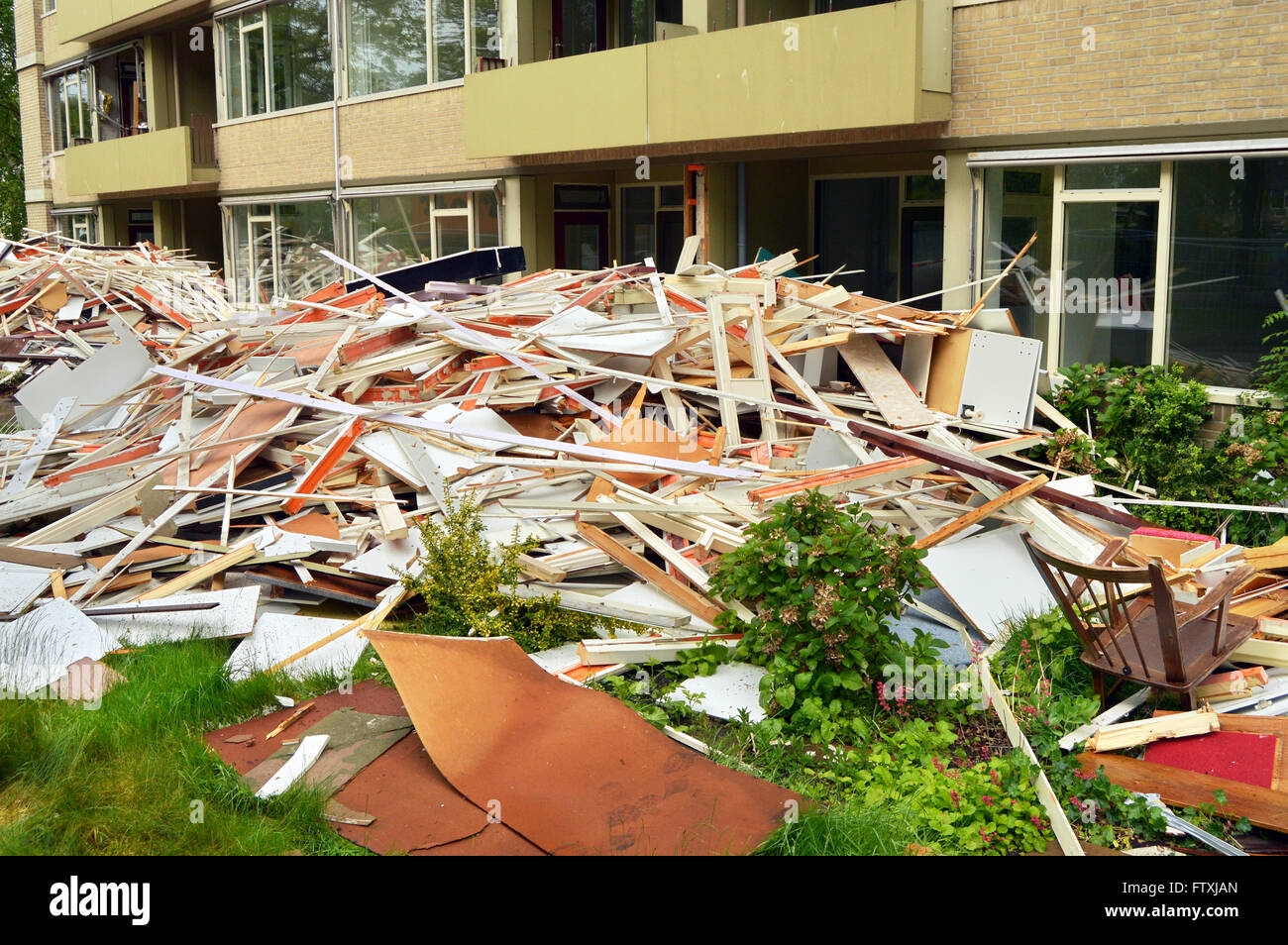 Demolition. Door and window frames stack of a deconstructed building ...