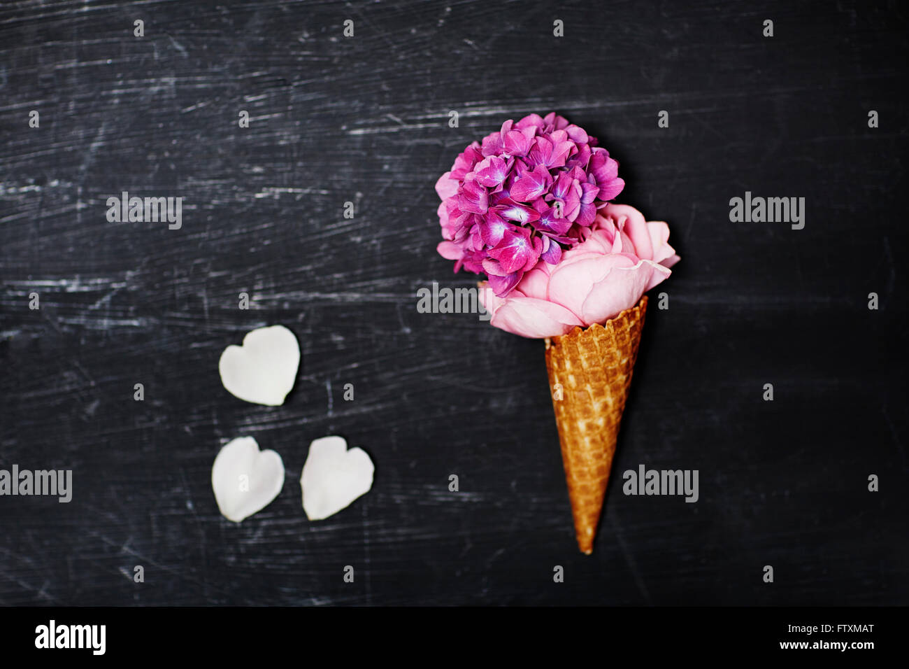 Conceptual ice-cream cone with heart shaped petals Stock Photo - Alamy