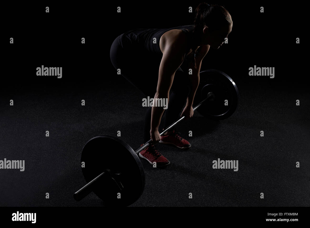 Women lifting a barbell in the gym Stock Photo - Alamy