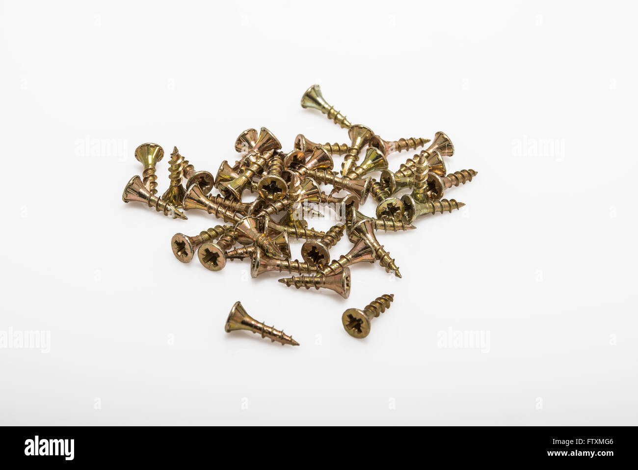 Stack of Screws on white background Stock Photo - Alamy