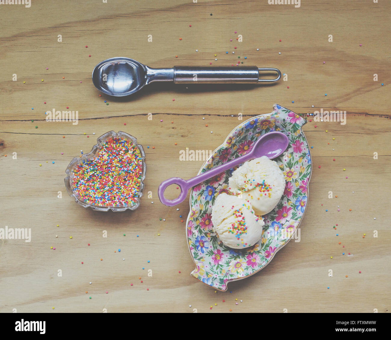 Overhead view of ice cream and sprinkles on table Stock Photo - Alamy