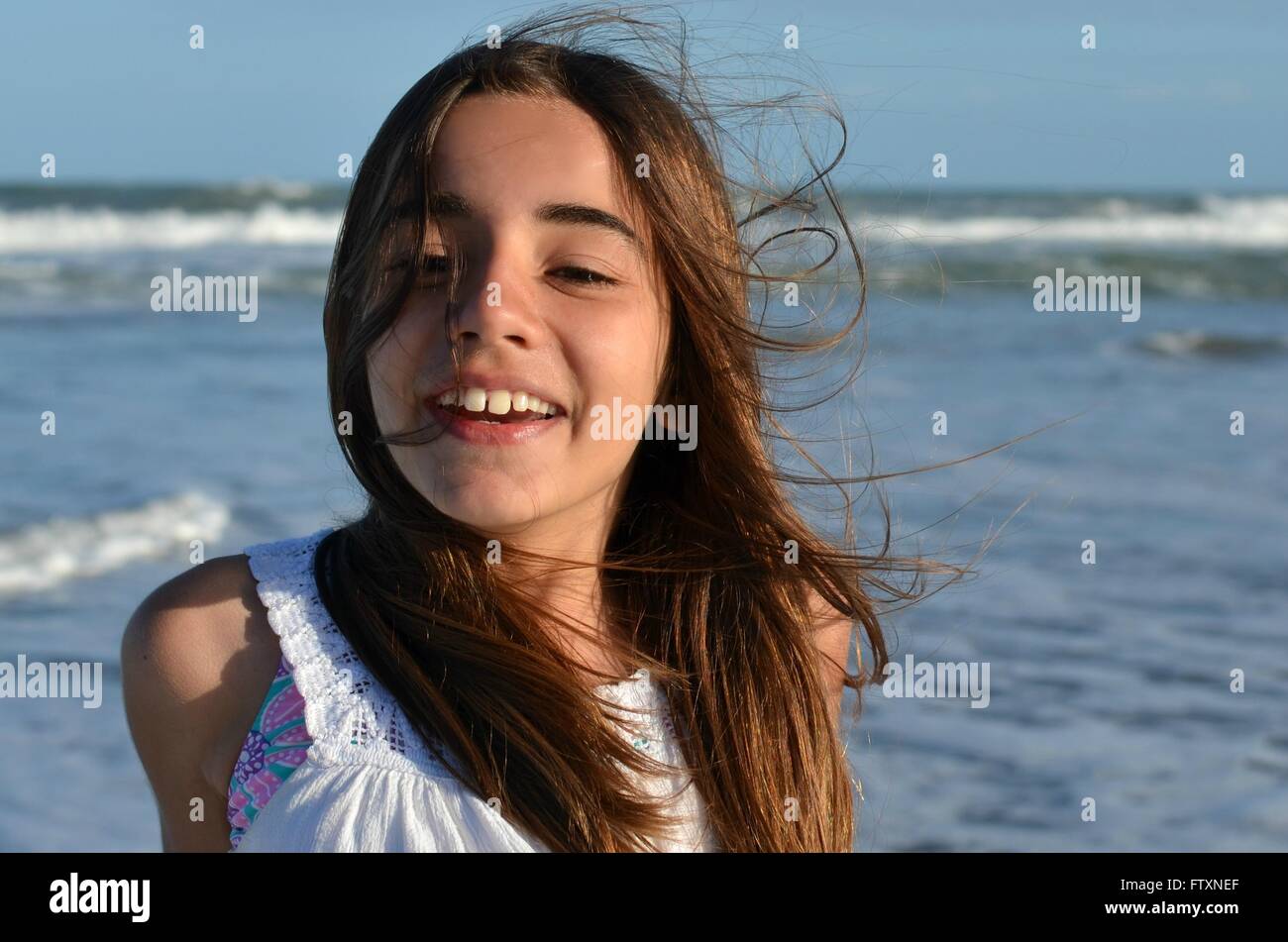 Person standing on the beach hi-res stock photography and images - Alamy