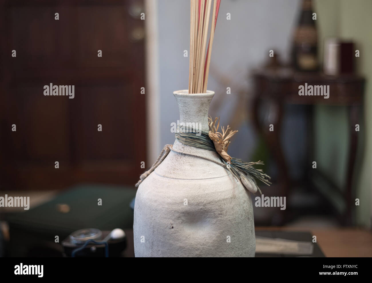 Vase on a table Stock Photo - Alamy