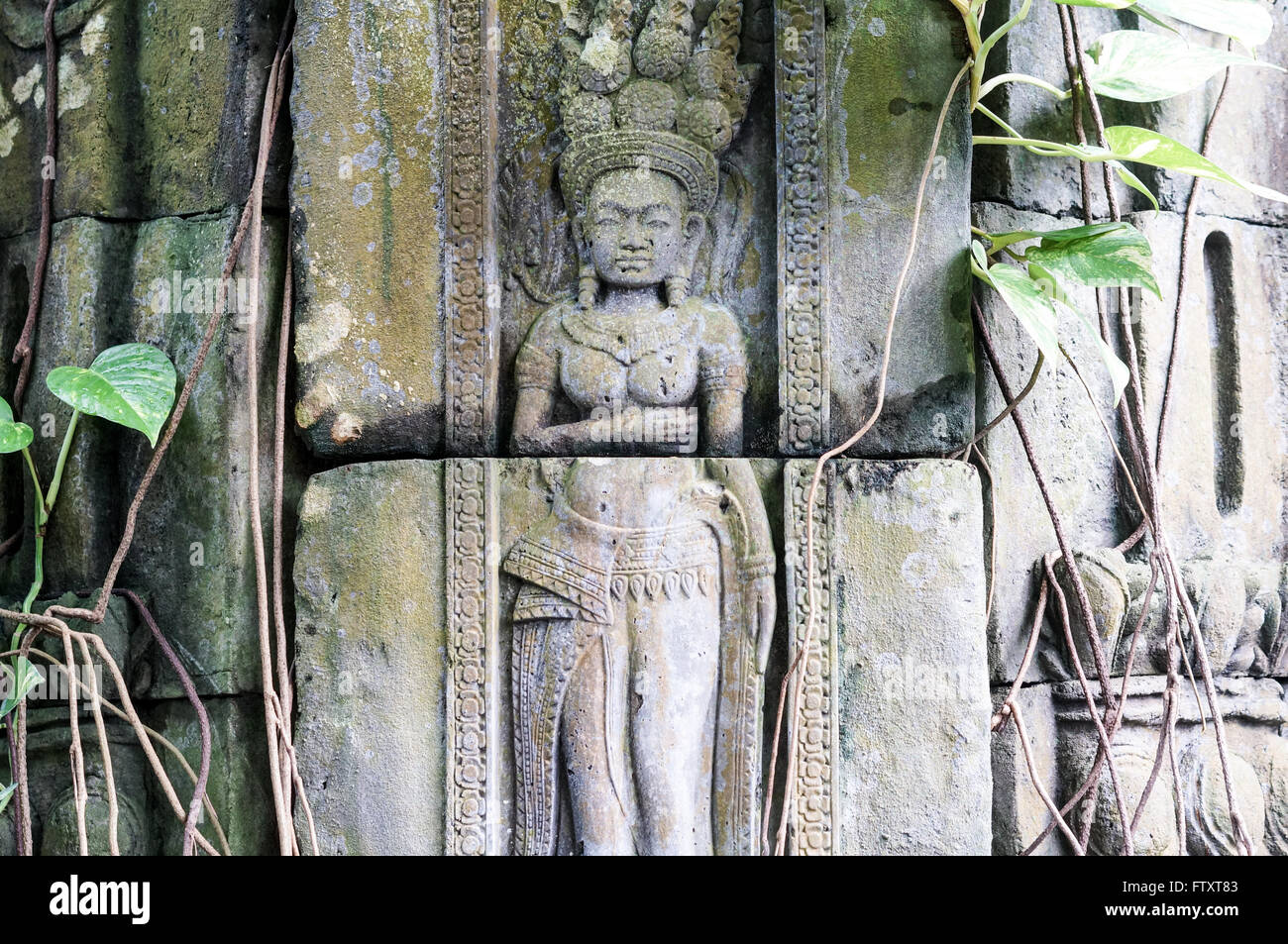 Stone tropical figure in forest, detail sections Stock Photo - Alamy