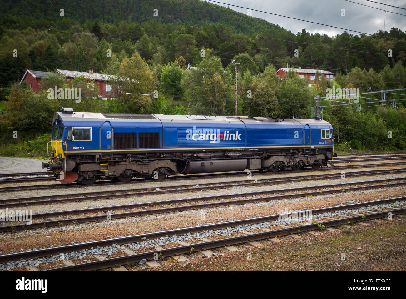 Blue locomotive on the tracks Stock Photo - Alamy