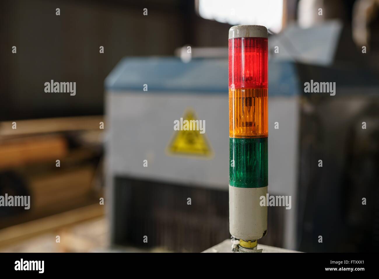 At sawmill. Image of tri-color LED on machine Stock Photo - Alamy