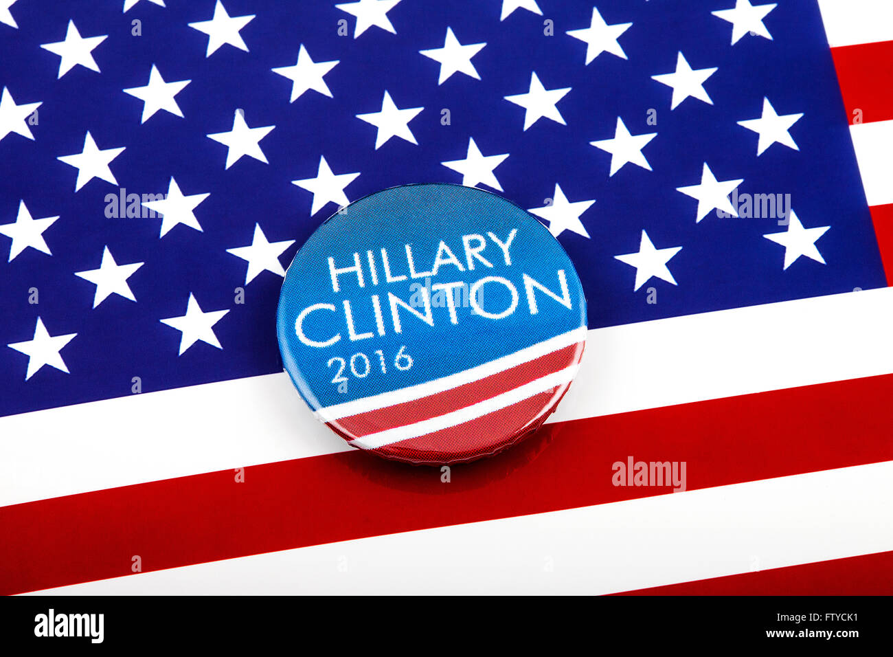 A Hillary Clinton 2016 pin badge over the US flag symbolizing her ...