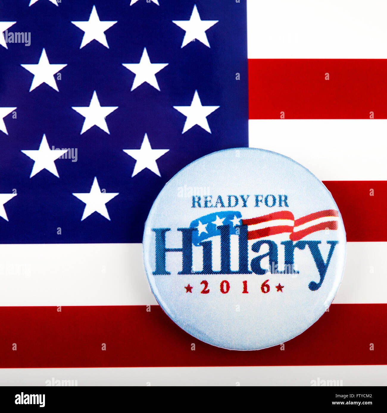 A Hillary Clinton 2016 pin badge over the US flag symbolizing her ...