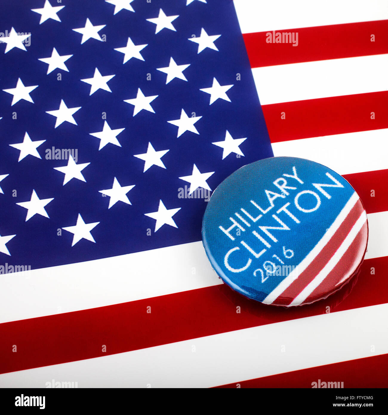 A Hillary Clinton 2016 pin badge over the US flag symbolizing her ...