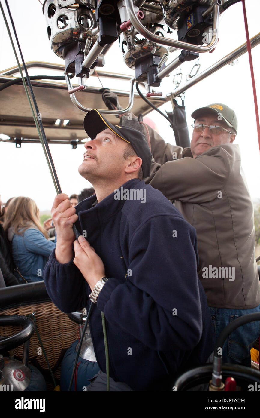 Hot air balloon pilot inside basket Stock Photo - Alamy