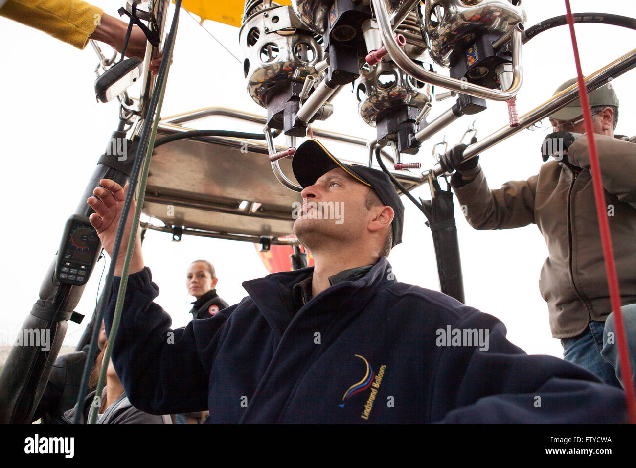 Hot air balloon pilot inside basket Stock Photo - Alamy